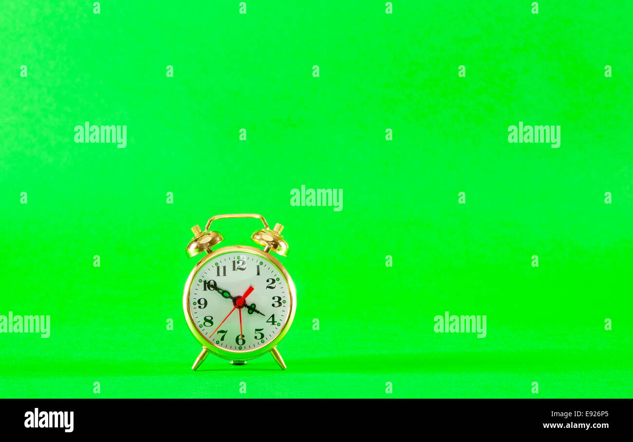 Golden retro style alarm clock Stock Photo - Alamy