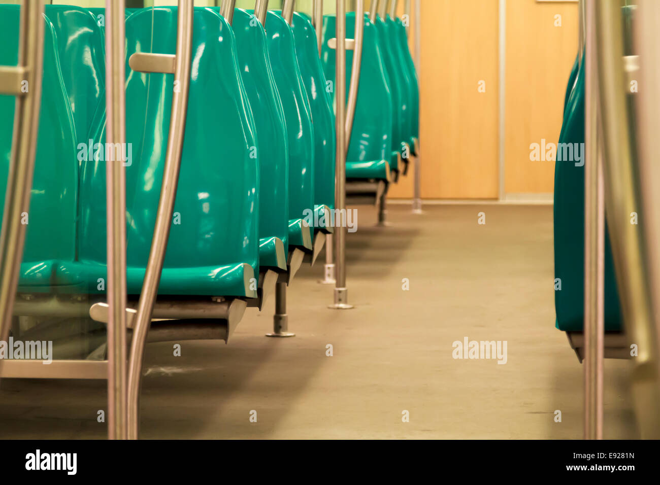 Empty modern metro train with green seats waiting at a station Stock ...