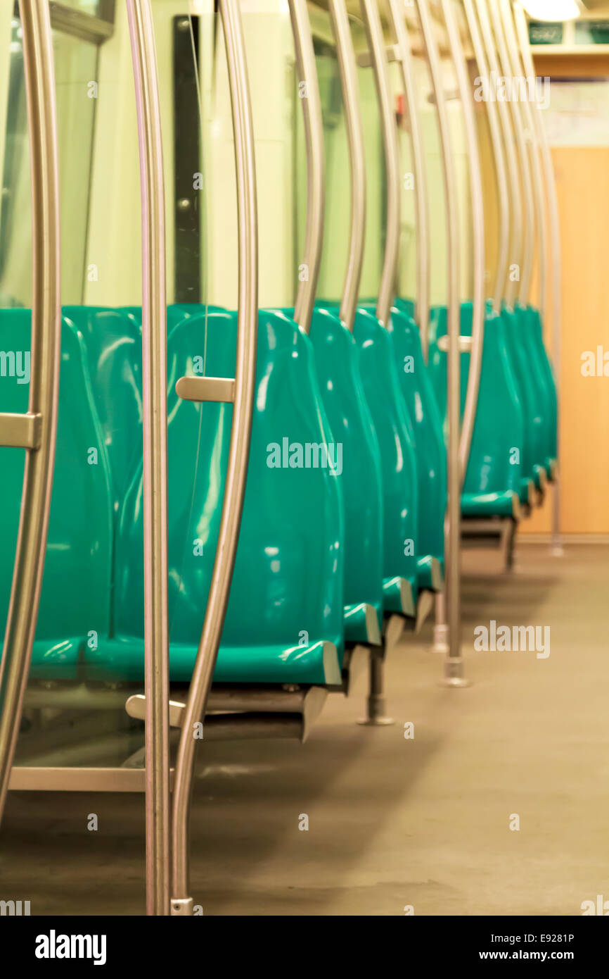 Empty modern metro train with green seats waiting at a station Stock ...