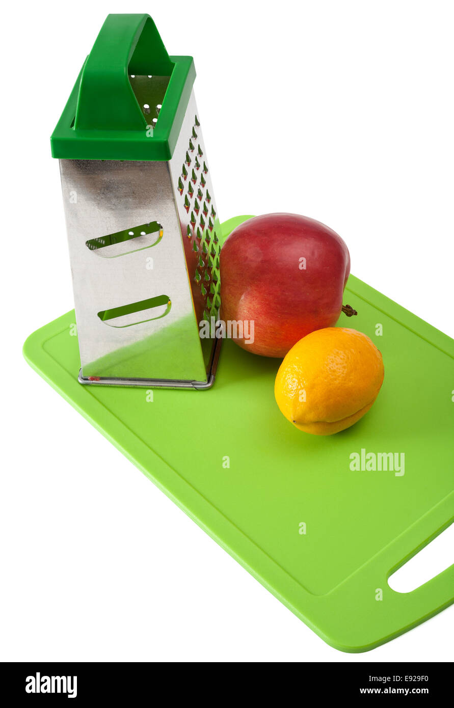Apple, lemon and grater Stock Photo - Alamy