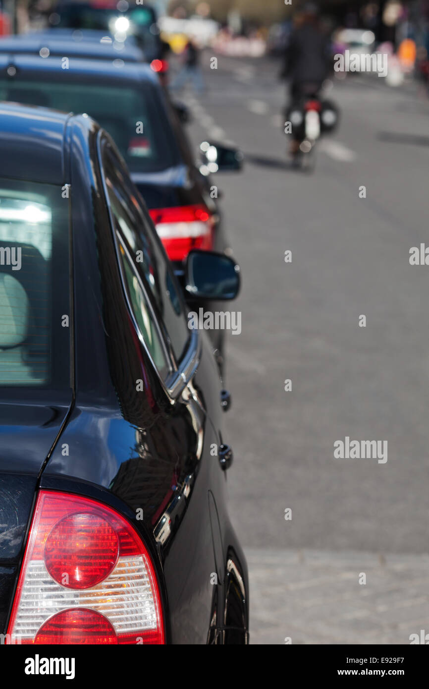parked cars roadside Stock Photo - Alamy