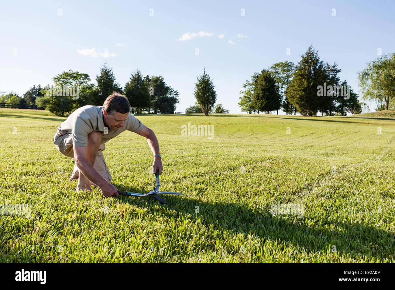 Fit man cutting grass hi-res stock photography and images - Alamy