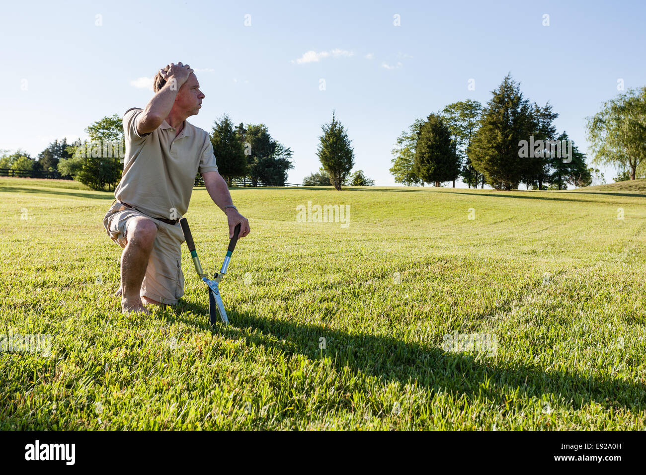 Fit man cutting grass hi-res stock photography and images - Alamy