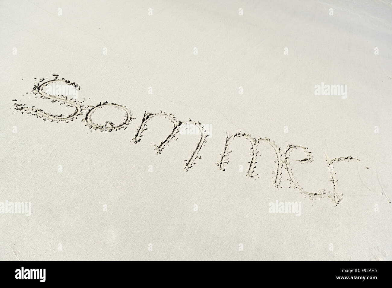 Summer written in sand Stock Photo - Alamy
