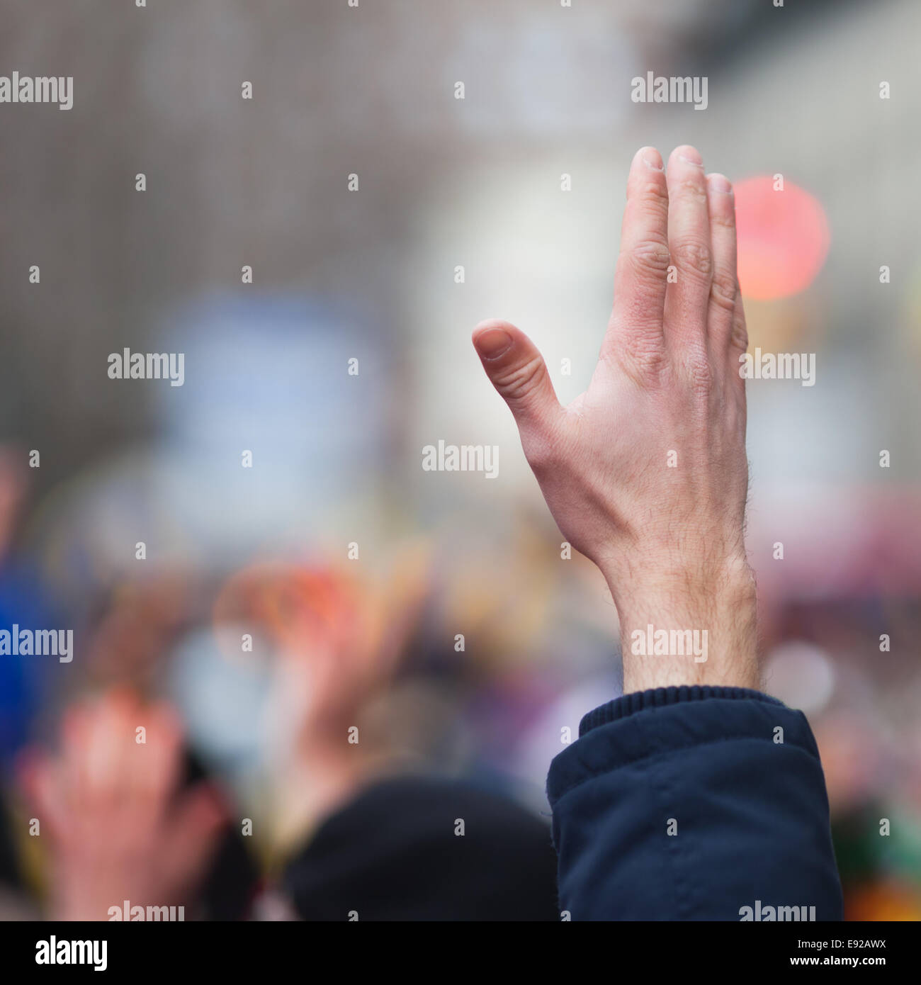 raised hand in the crowd Stock Photo - Alamy
