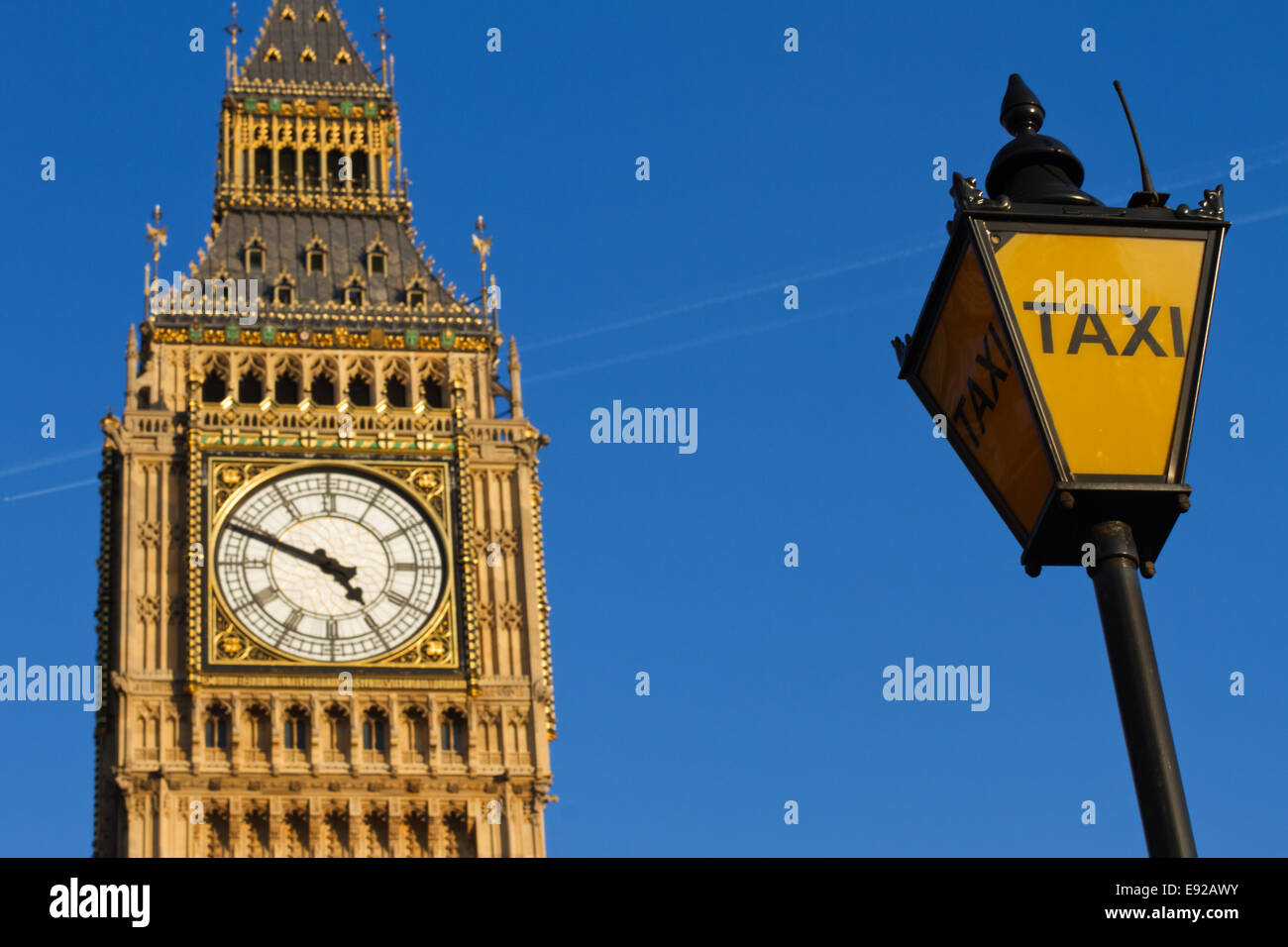 Big Ben and taxi sign Stock Photo - Alamy