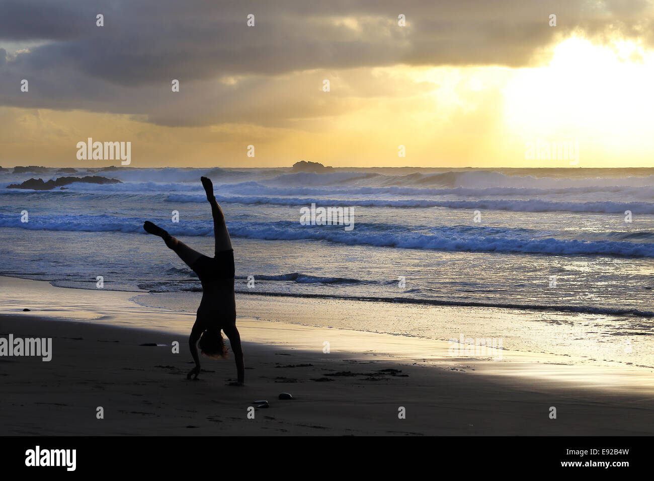 Man doing cartwheels on the beach in Castlejo, Costa Vicentina ...