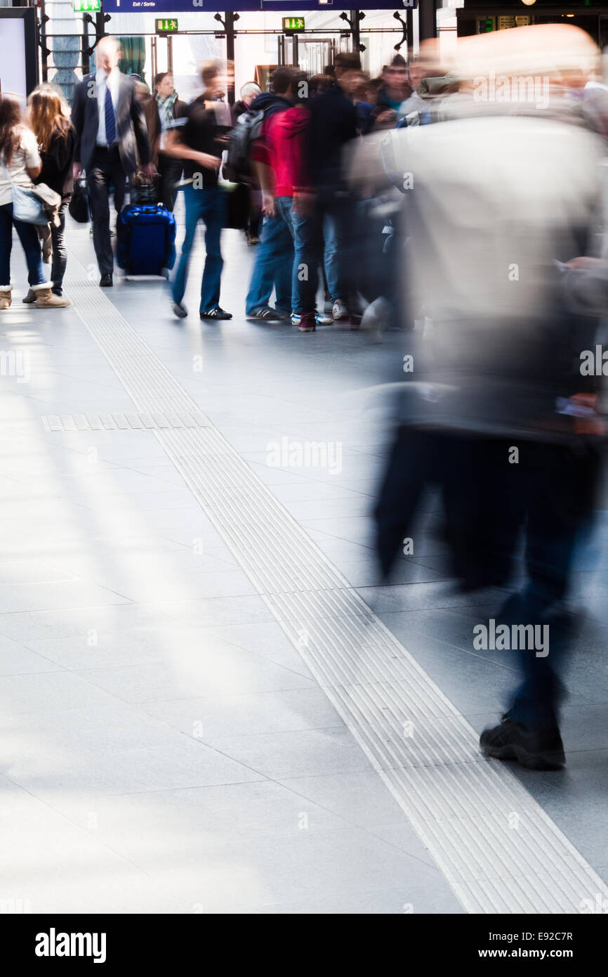 traveling people in the station on the move Stock Photo - Alamy