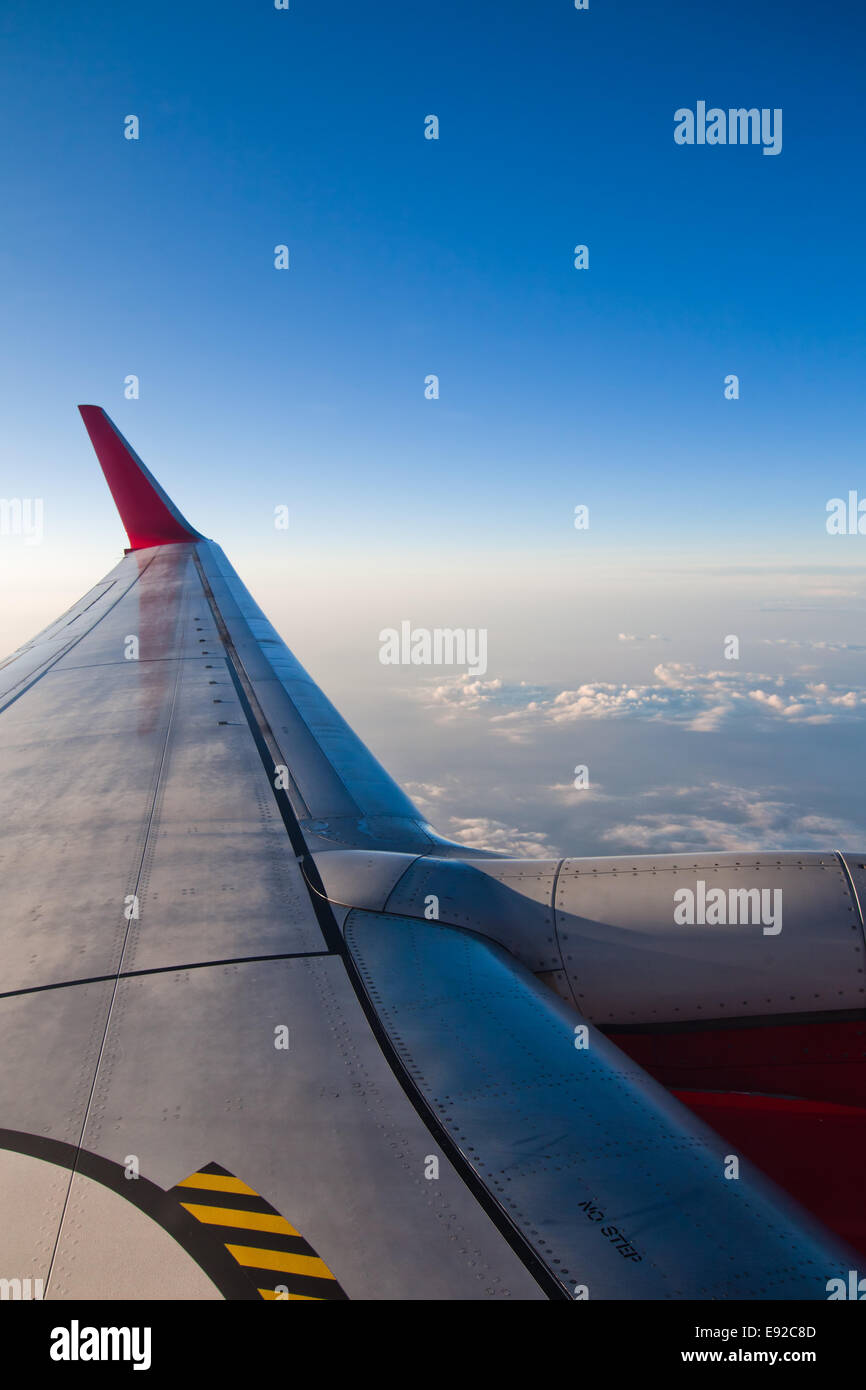 View Of Airplane Flying Over Clouds Stock Photos & View Of Airplane ...