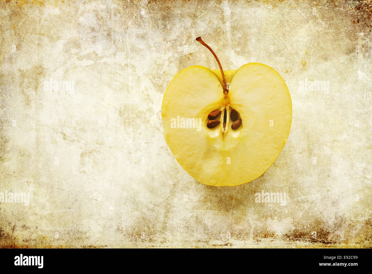 apple half on a grunge background Stock Photo - Alamy