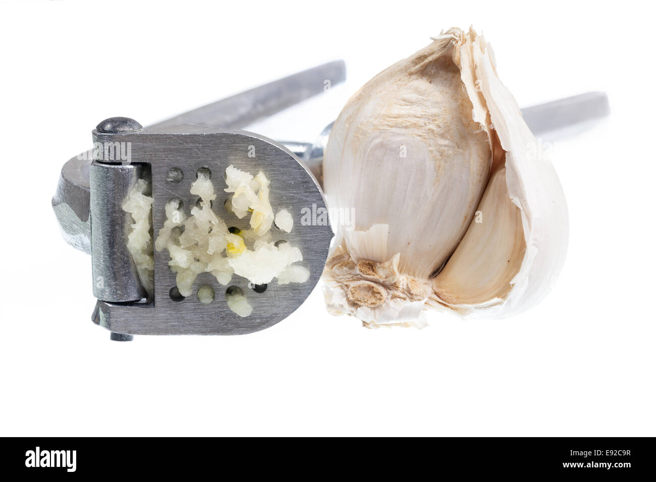 Garlic Press isolated against white Stock Photo - Alamy