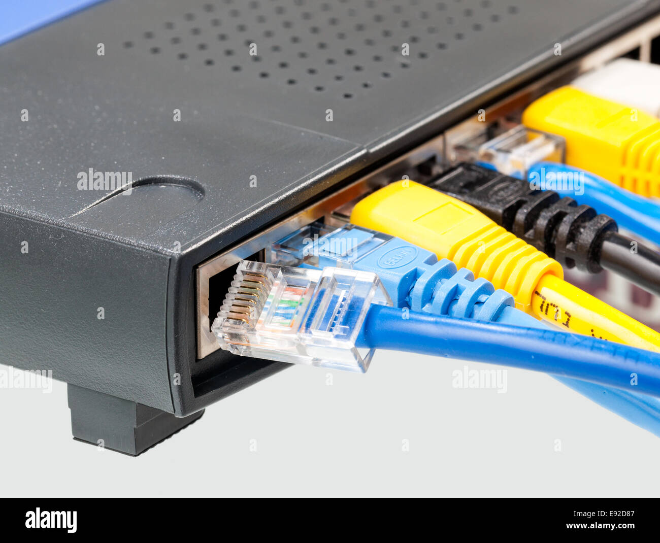 Cat 5 cables in multiple colors in router Stock Photo - Alamy
