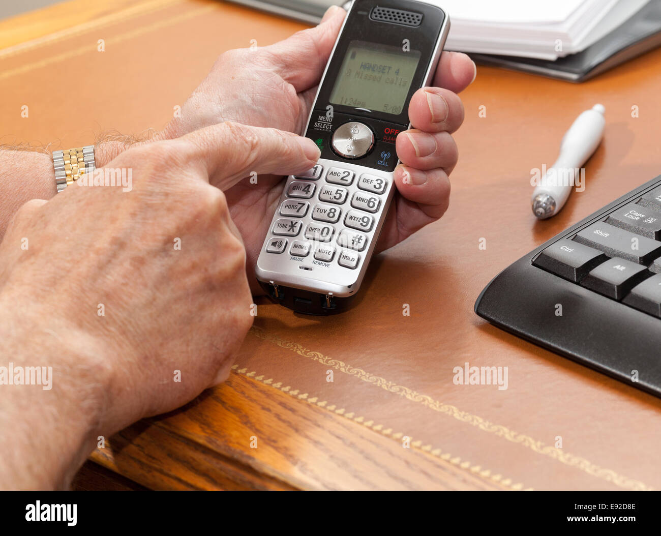 Man dialing from wireless phone Stock Photo - Alamy