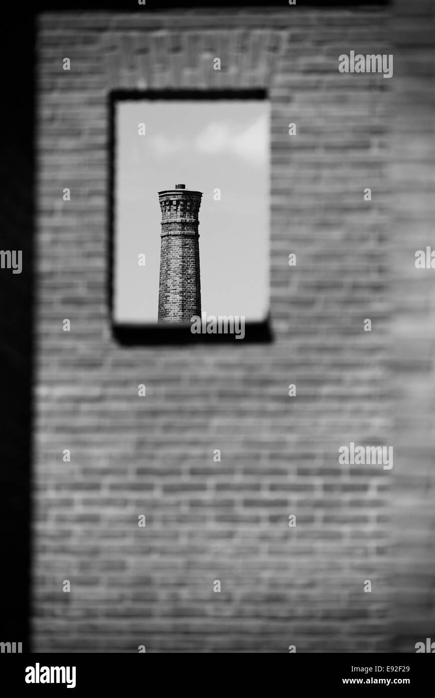 Brick wall and window with view of brick chimney. Public artwork by Per ...