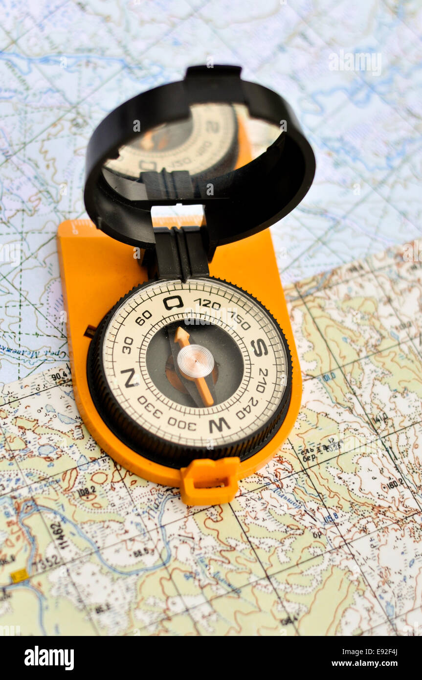 Compass on the map. Magnetic compass in the expanded form is situated ...