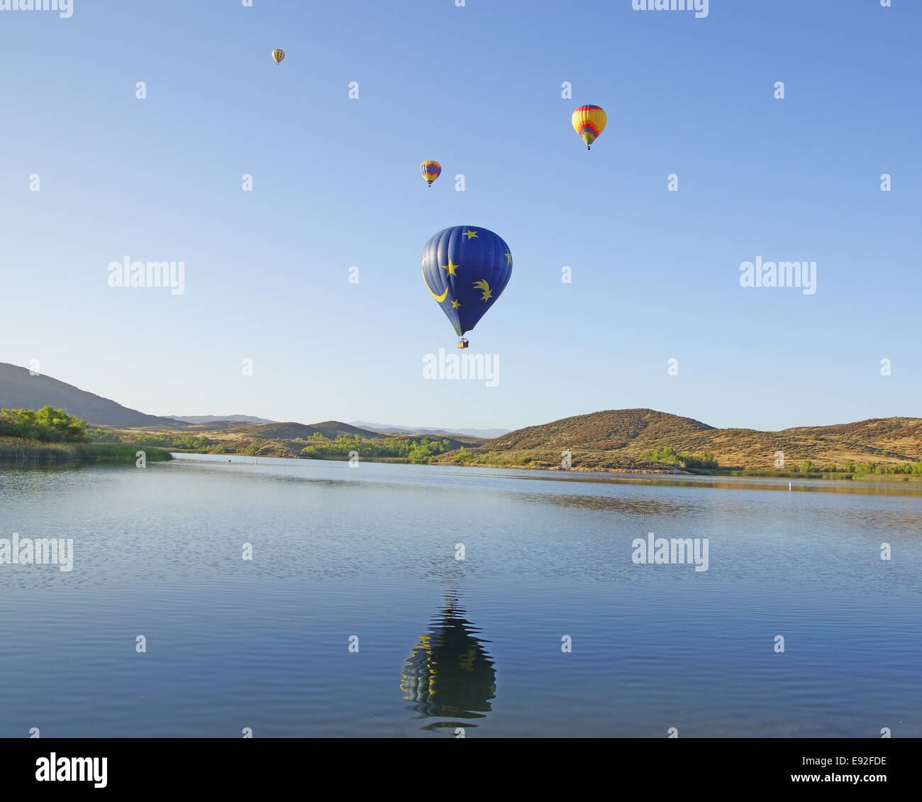 Balloons Floating over Lake Stock Photo - Alamy