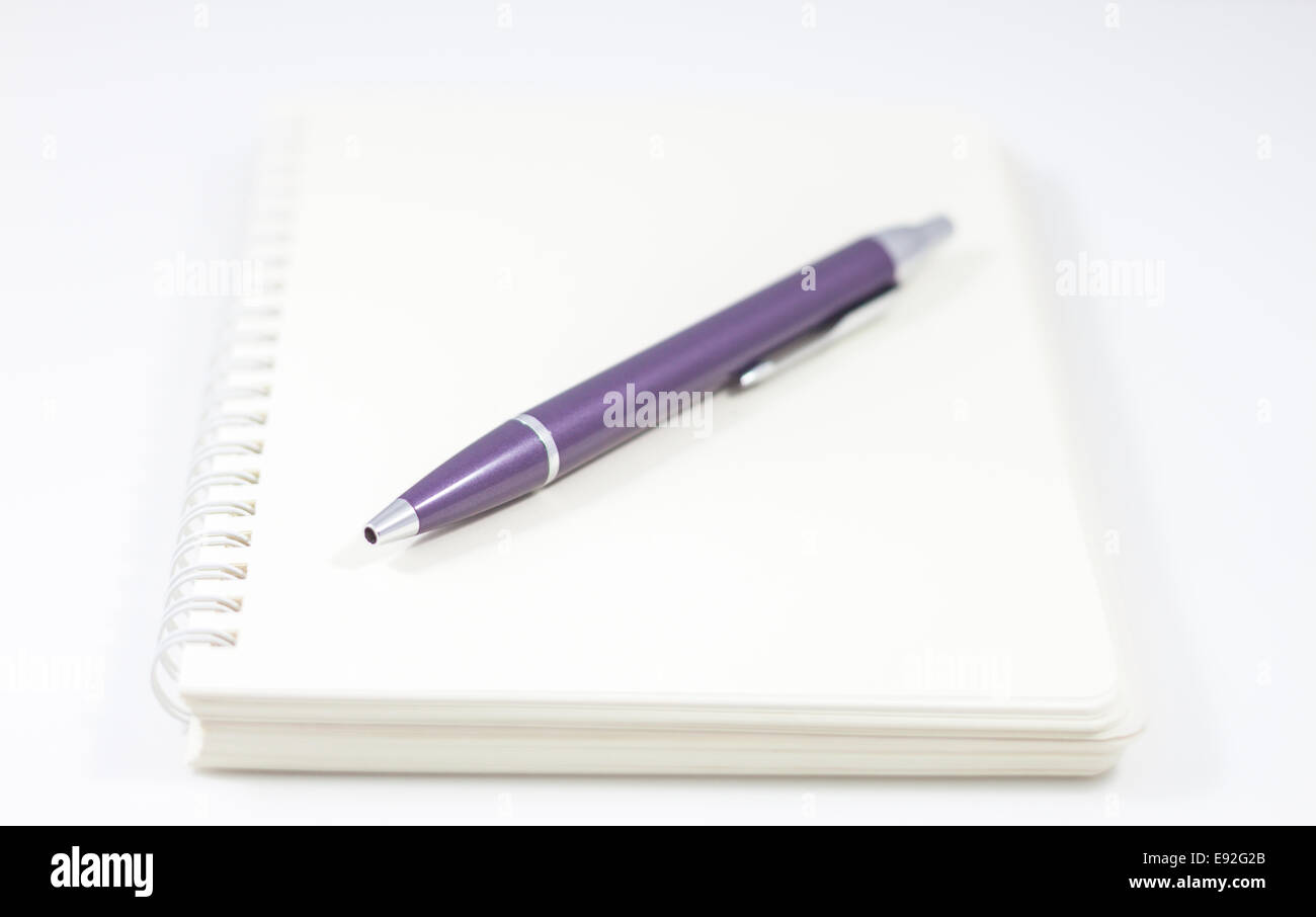 Spiral notebook with pen isolated on white background, stock photo ...