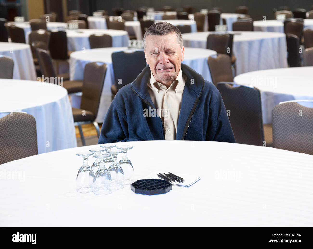 Man crying in empty conference room Stock Photo - Alamy