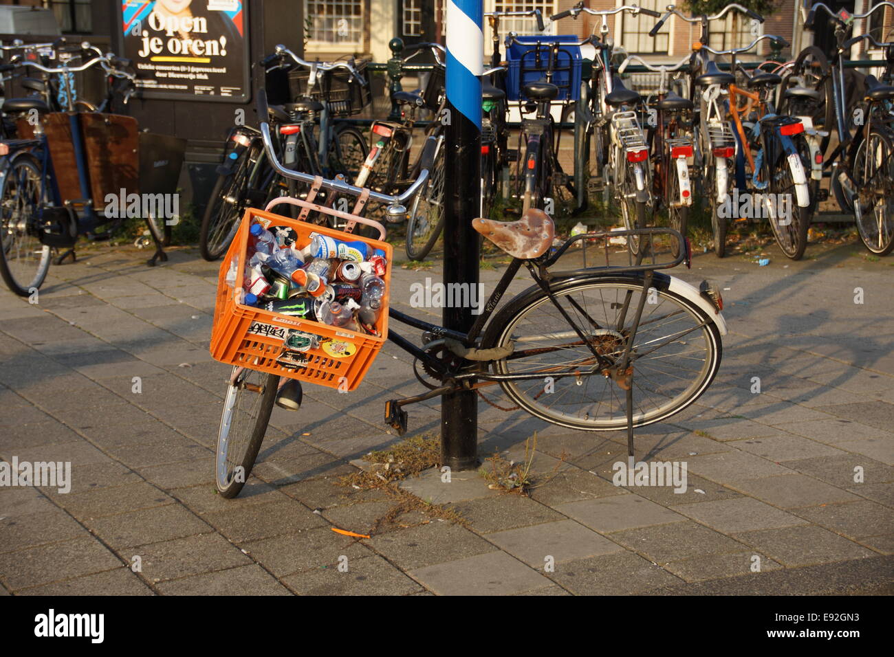 Bicycle basket filled with garbage Stock Photo - Alamy