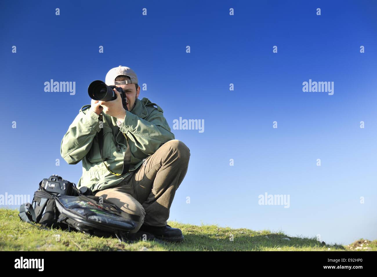 Nature photographer with digital camera Stock Photo - Alamy