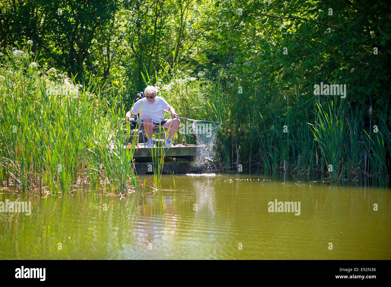 Man catching fish hi-res stock photography and images - Alamy
