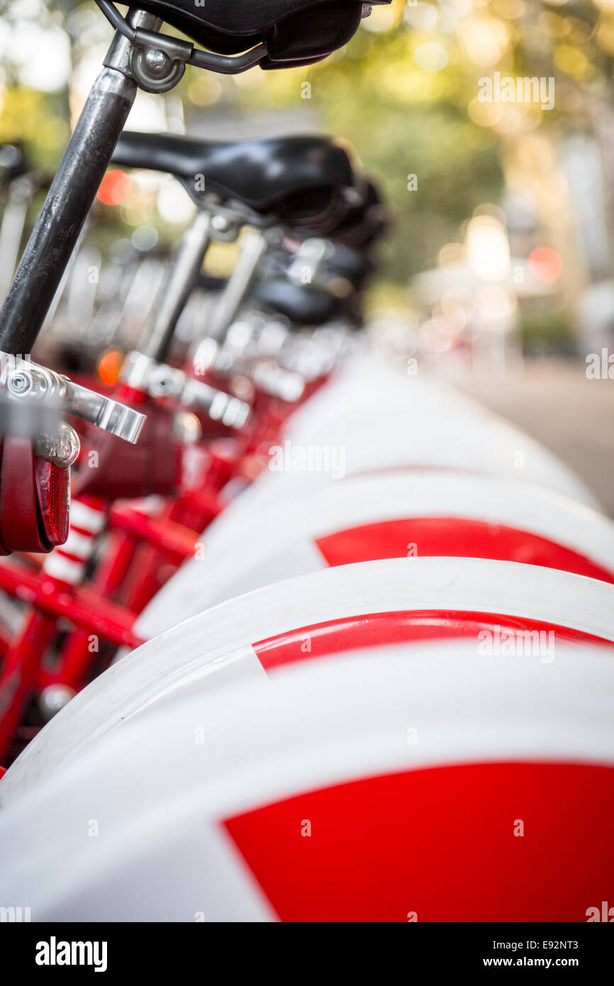 perspective row of bikes, red and white Stock Photo - Alamy