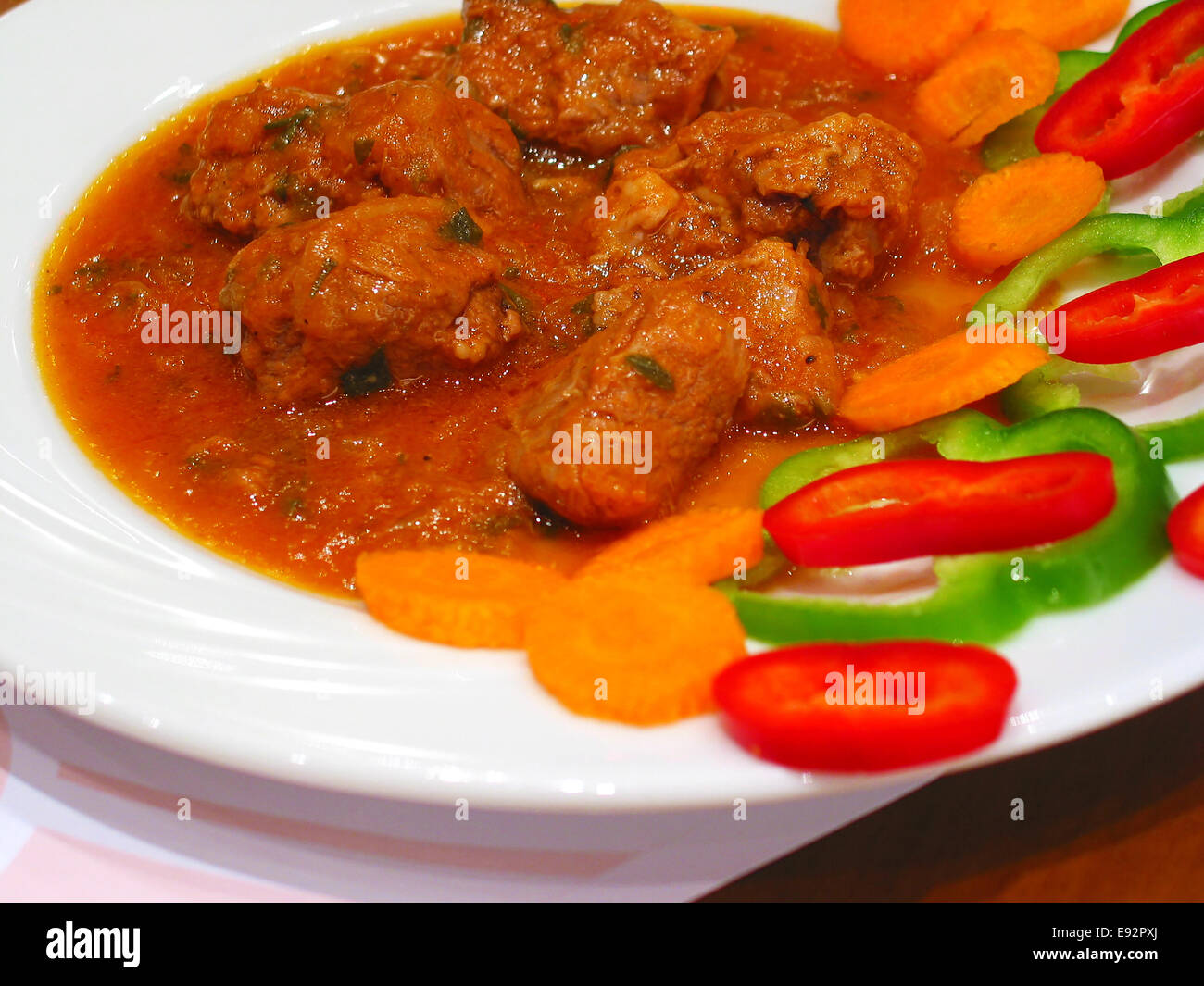 Beef in red sauce Stock Photo - Alamy