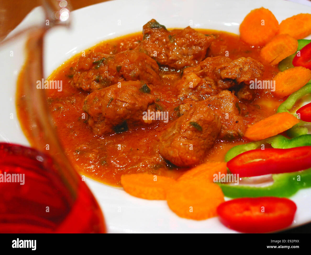 Beef in red sauce Stock Photo - Alamy