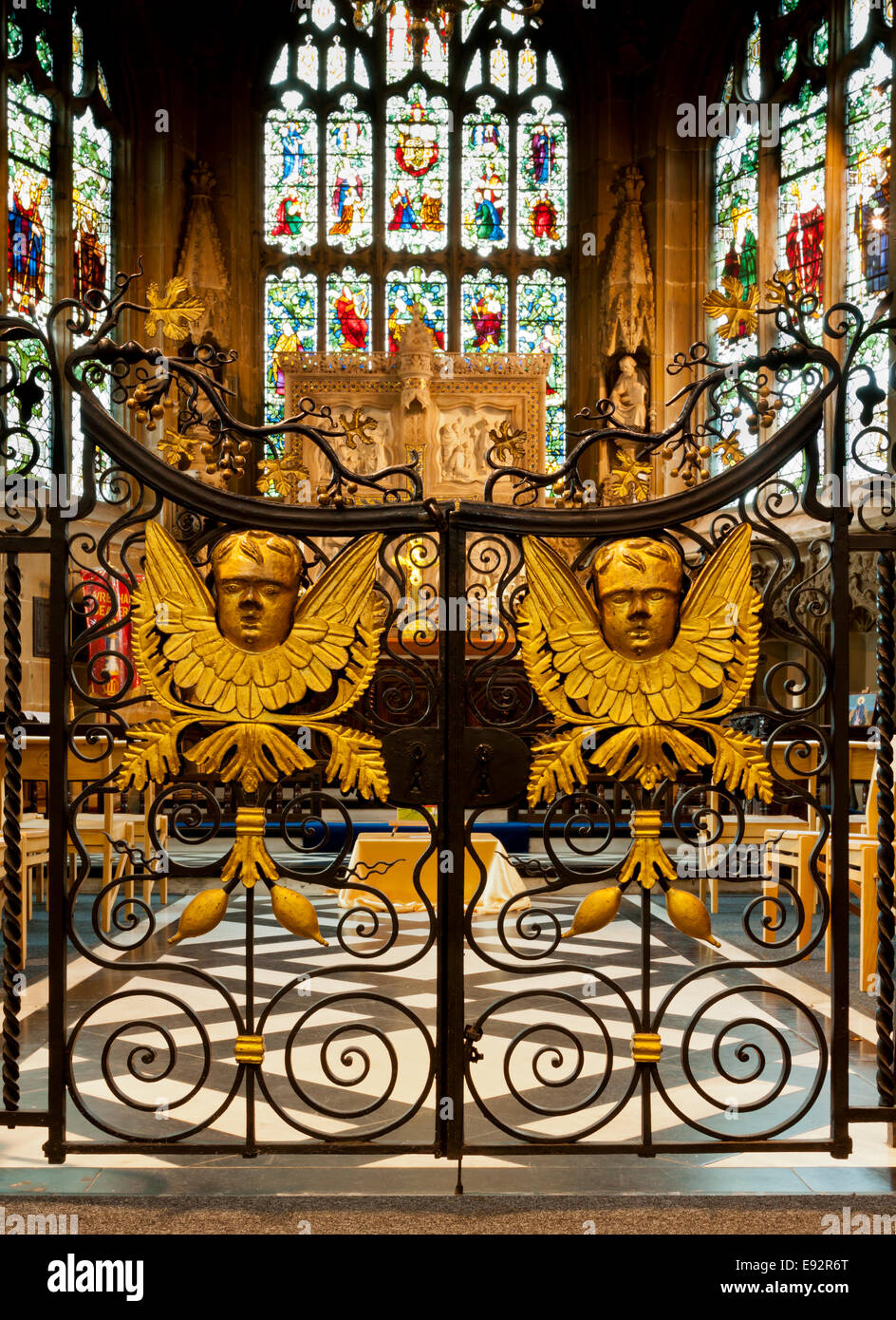 Wrought iron chancel gates with golden cherubs inside St Giles Church ...