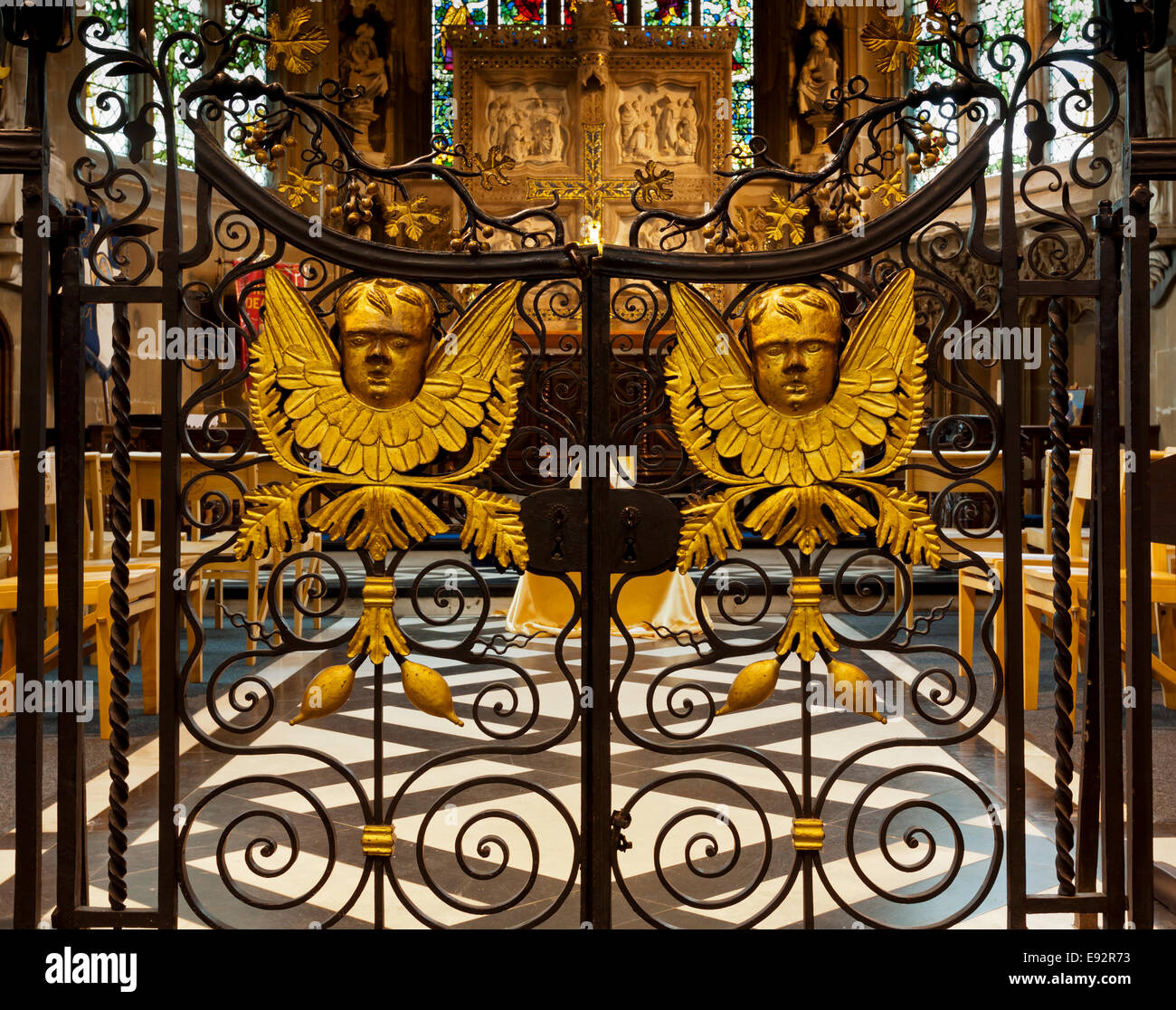 Wrought iron chancel gates with golden cherubs inside St Giles Church ...