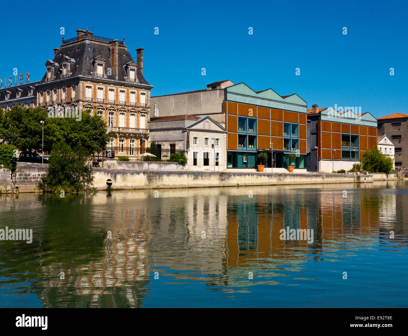 The Courvoisier cognac distillery next to the Charente River in Jarnac ...