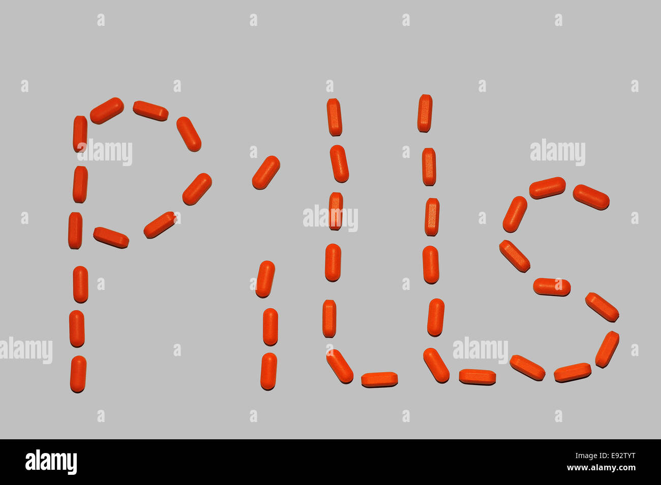 An image of the word pills made from orange medical pills against a ...