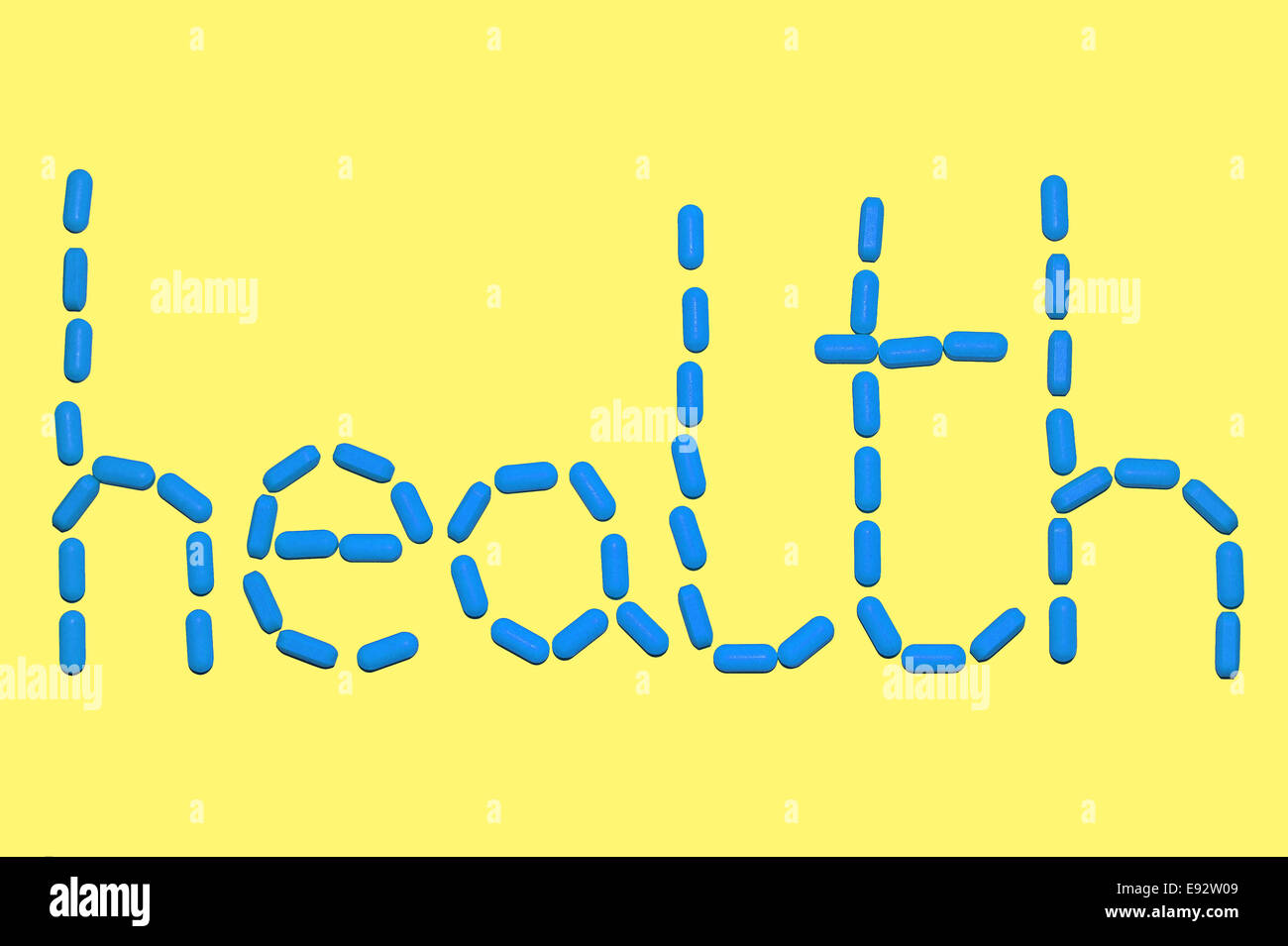An image of the word health made from blue medical pills against a ...