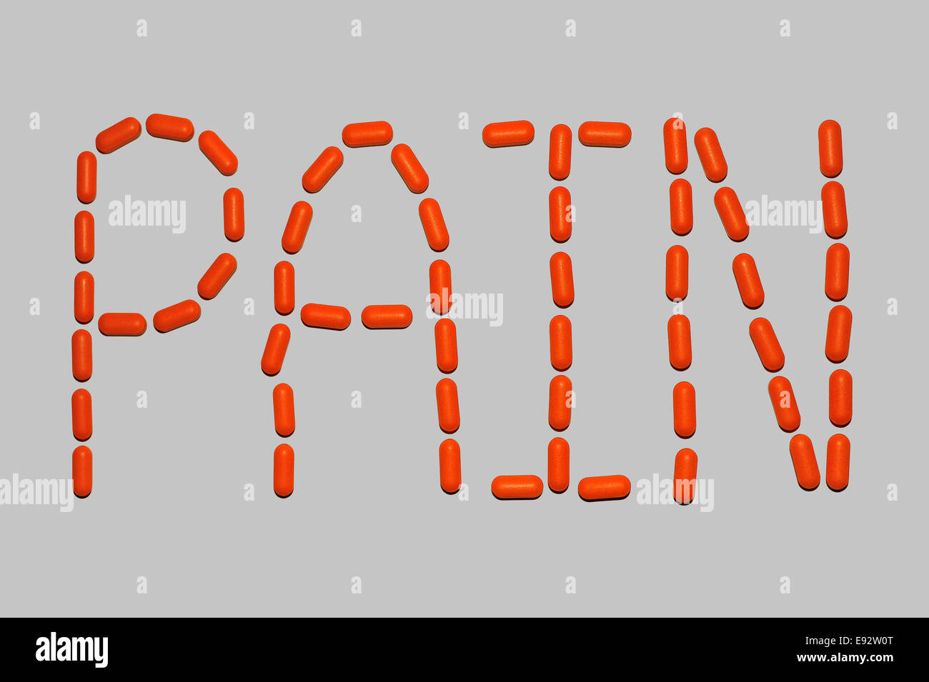 An image of the word pain made from orange medical pills Stock Photo ...