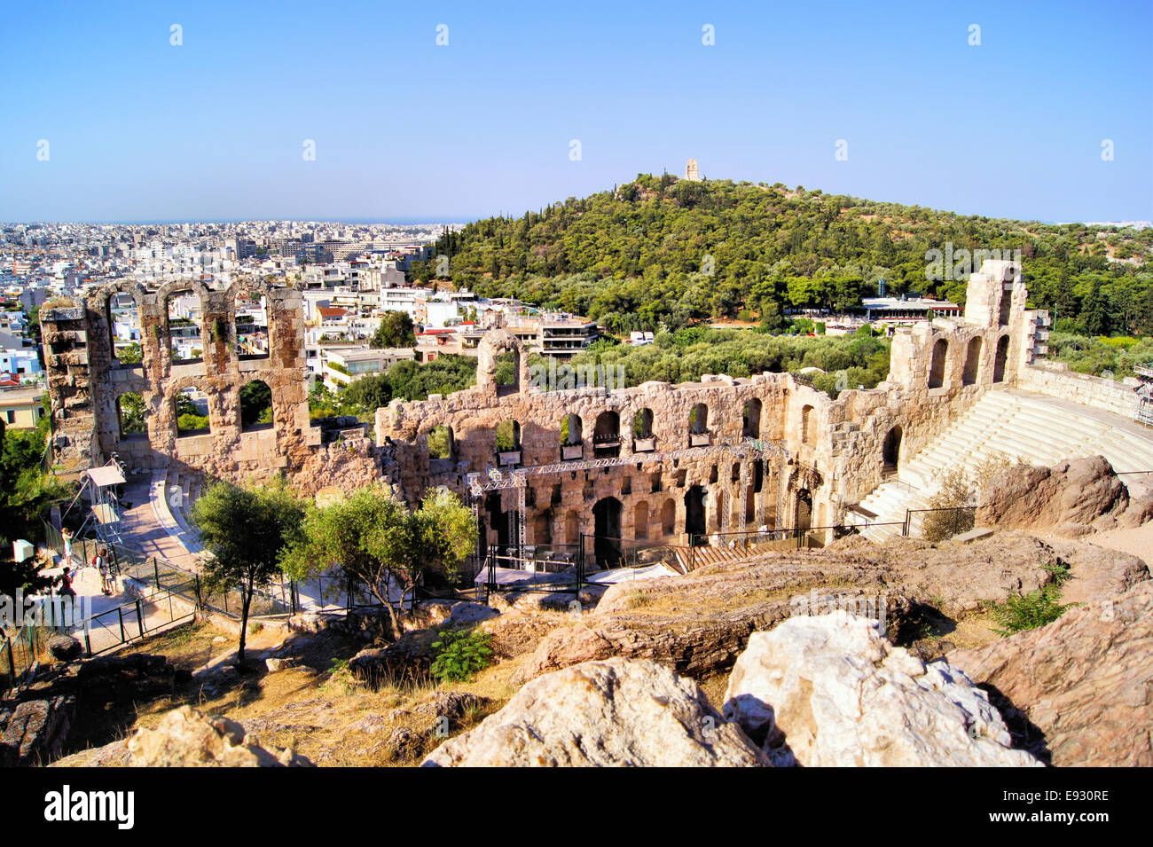Ancient ruined Greek theatre at the Acropolis with Athens view behind ...