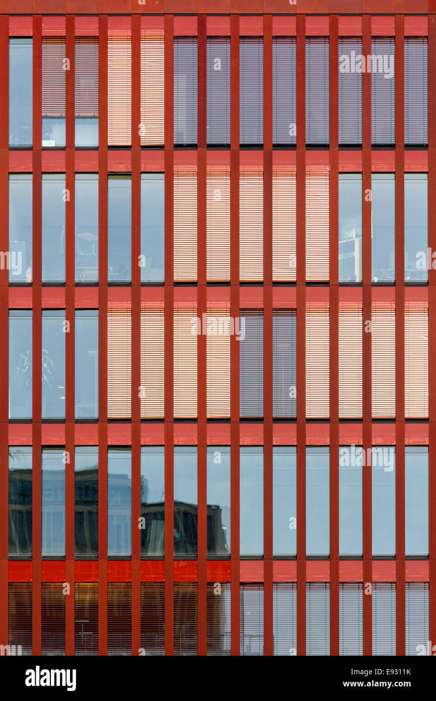 Facade detail on a modern rust red office building Stock Photo - Alamy