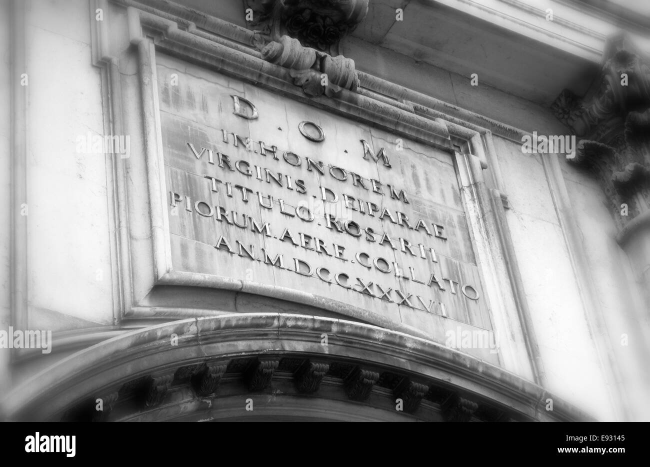 Latin engraving on the facade of a church in Venice, Italy Stock Photo ...