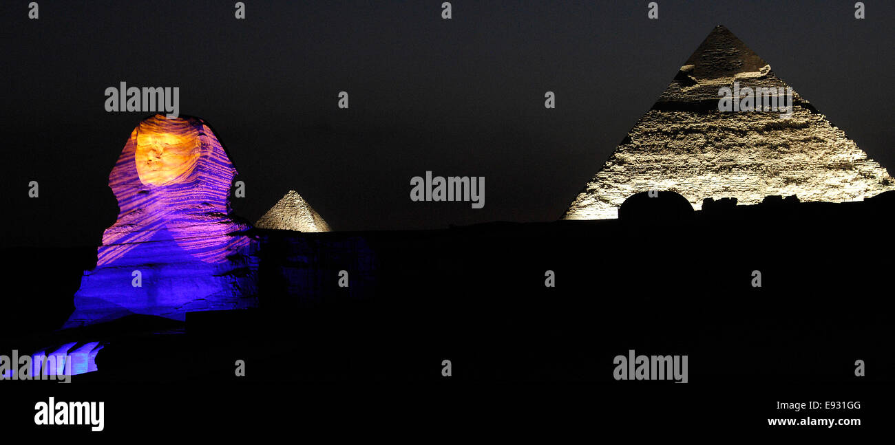 The Great Pyramid and The Great Sphinx of Giza, Egypt, lit up at night ...
