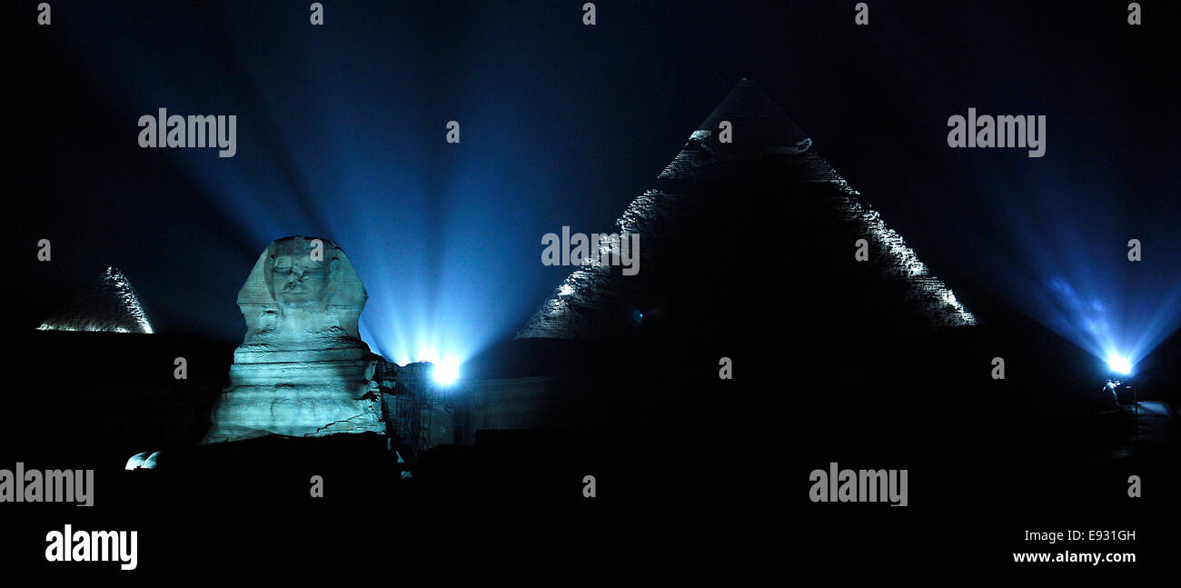 The Great Pyramid and The Great Sphinx of Giza, Egypt, lit up at night ...