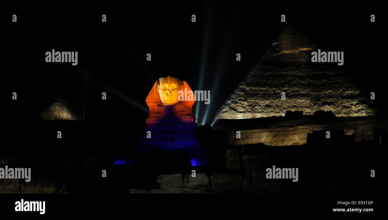 The Great Pyramid and The Great Sphinx of Giza, Egypt, lit up at night ...