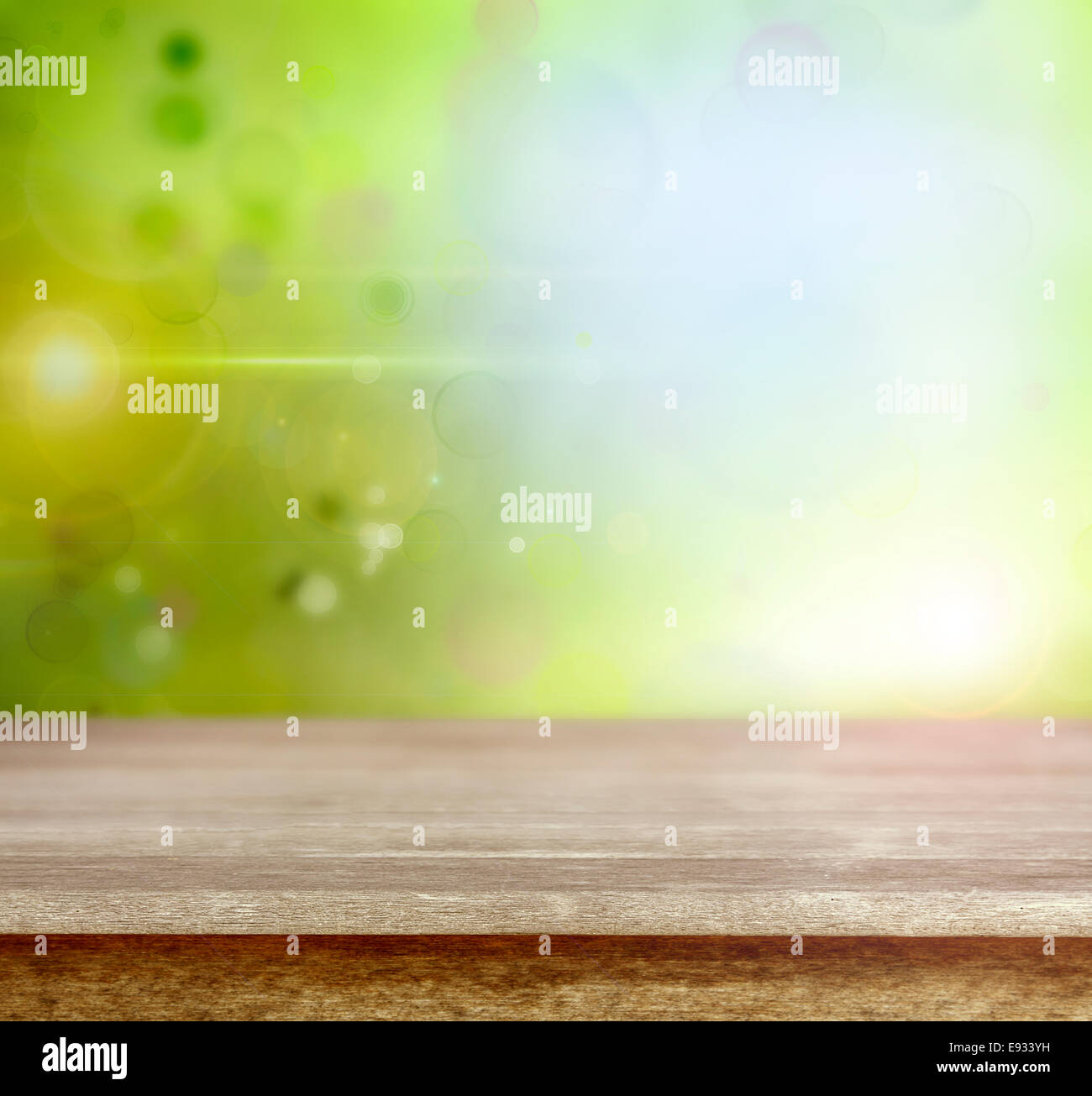 Empty table in front of abstract green background Stock Photo - Alamy
