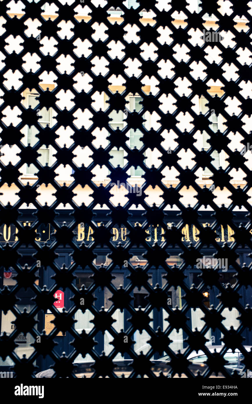 Decorative repeating window pattern on building entrance looking out to ...