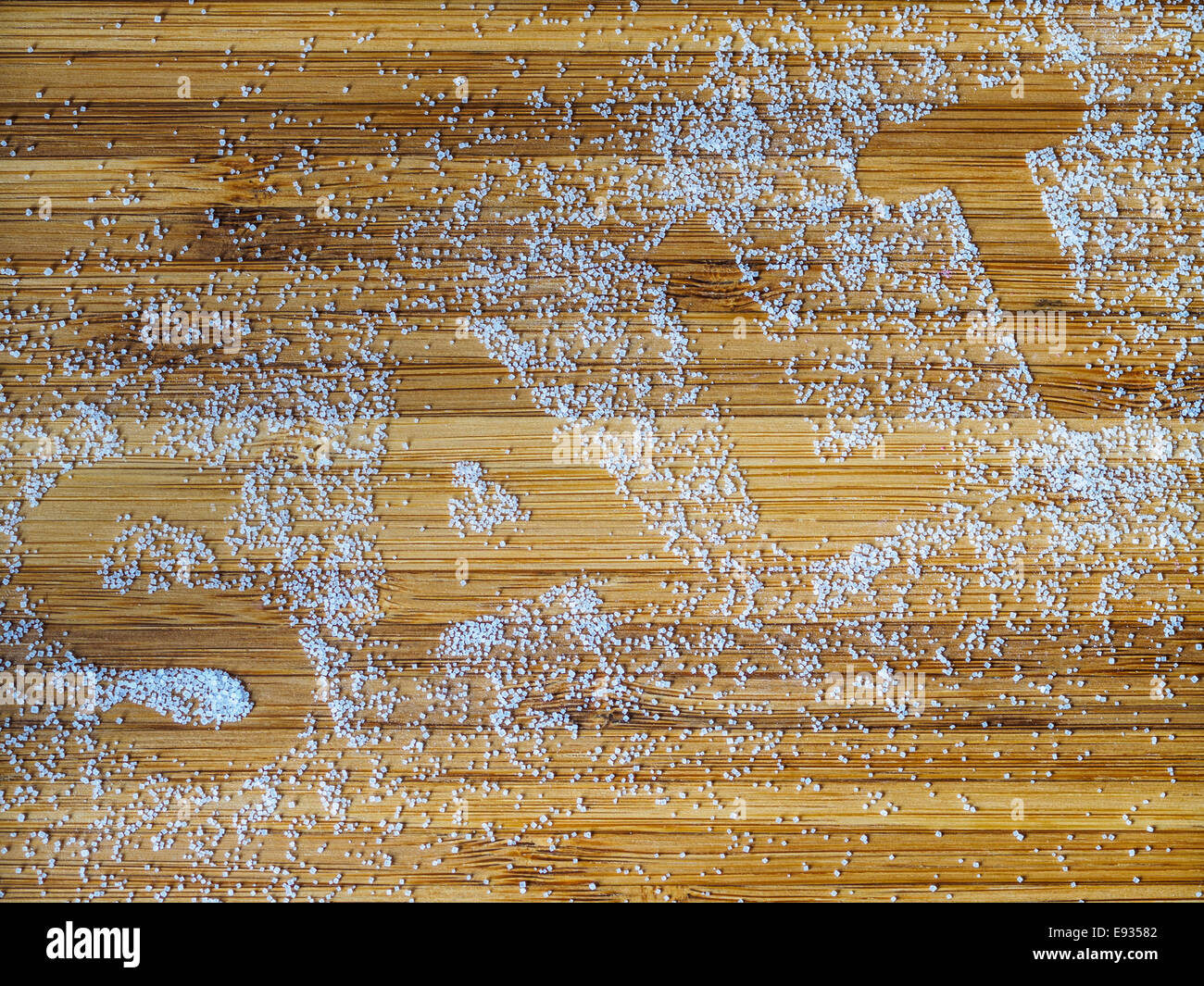 Salt grains on wood background Stock Photo - Alamy