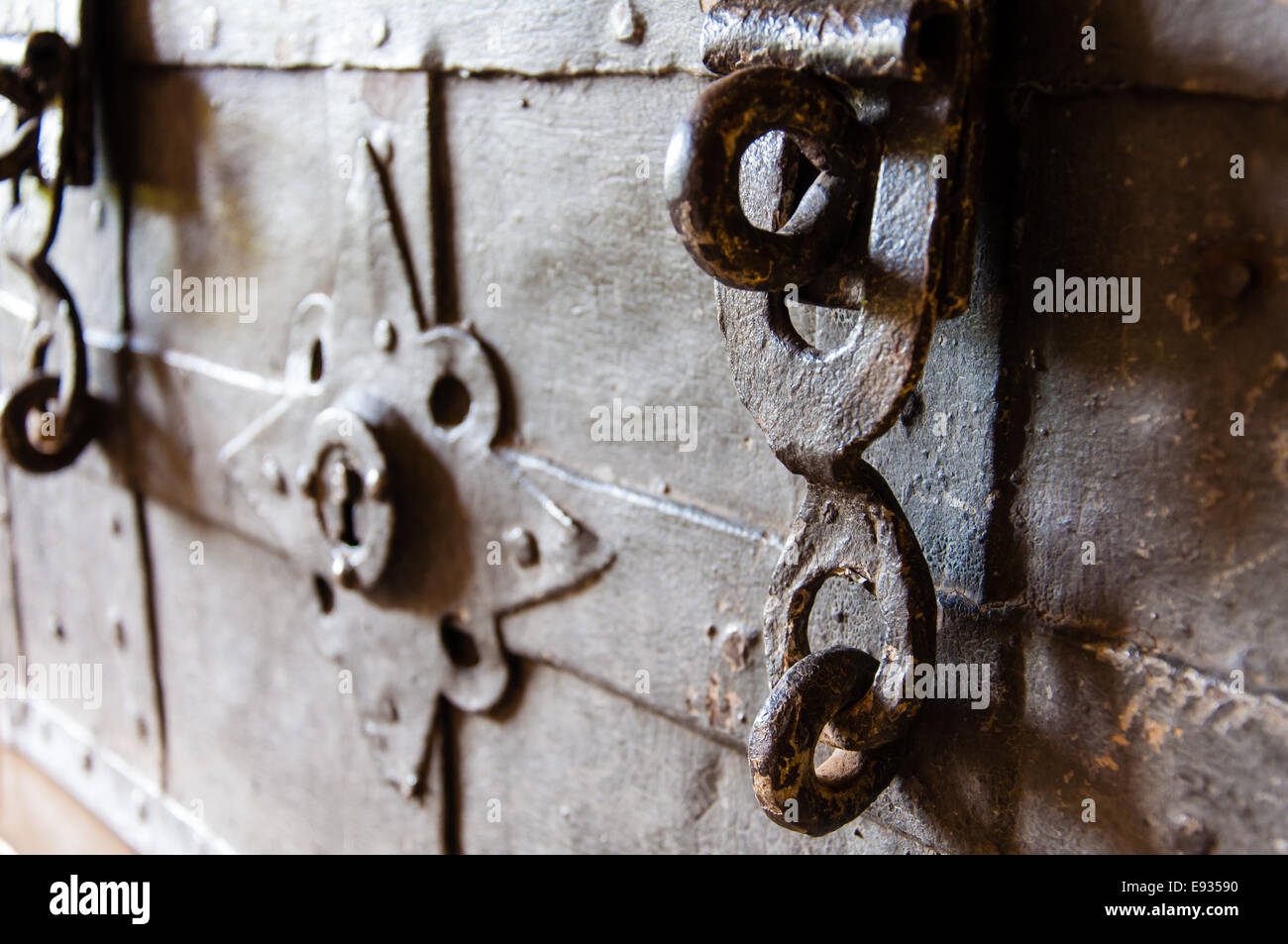 Closeup on the locks of an old metal chest Stock Photo - Alamy