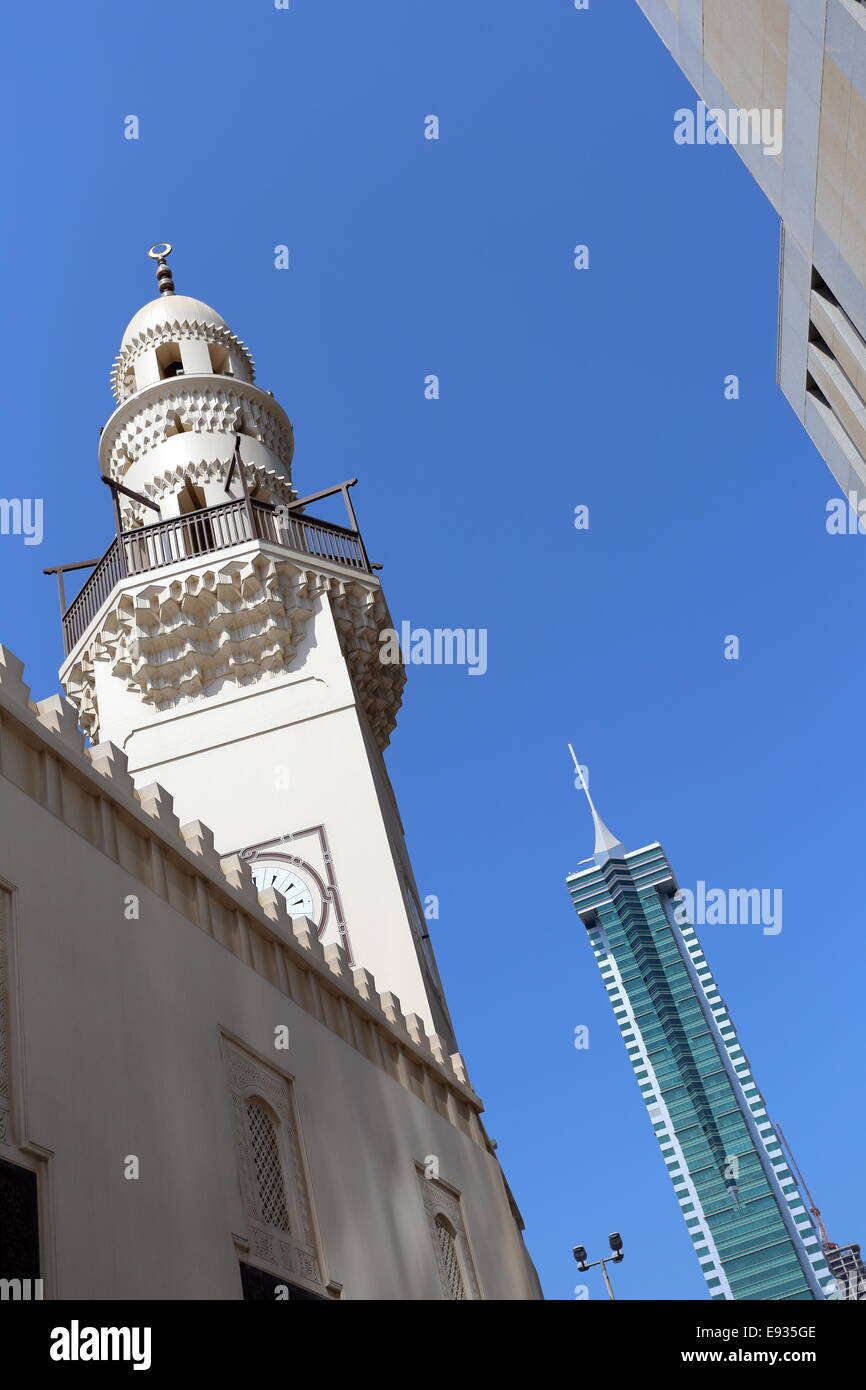 Al Yateem Mosque and the Batelco Building with one of the towers of the ...