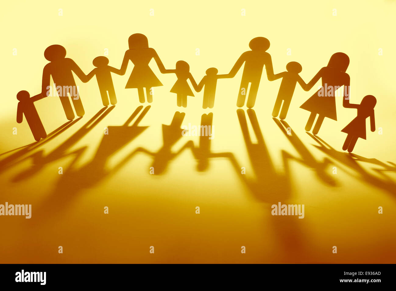 Family paper chain cutout holding hands Stock Photo - Alamy