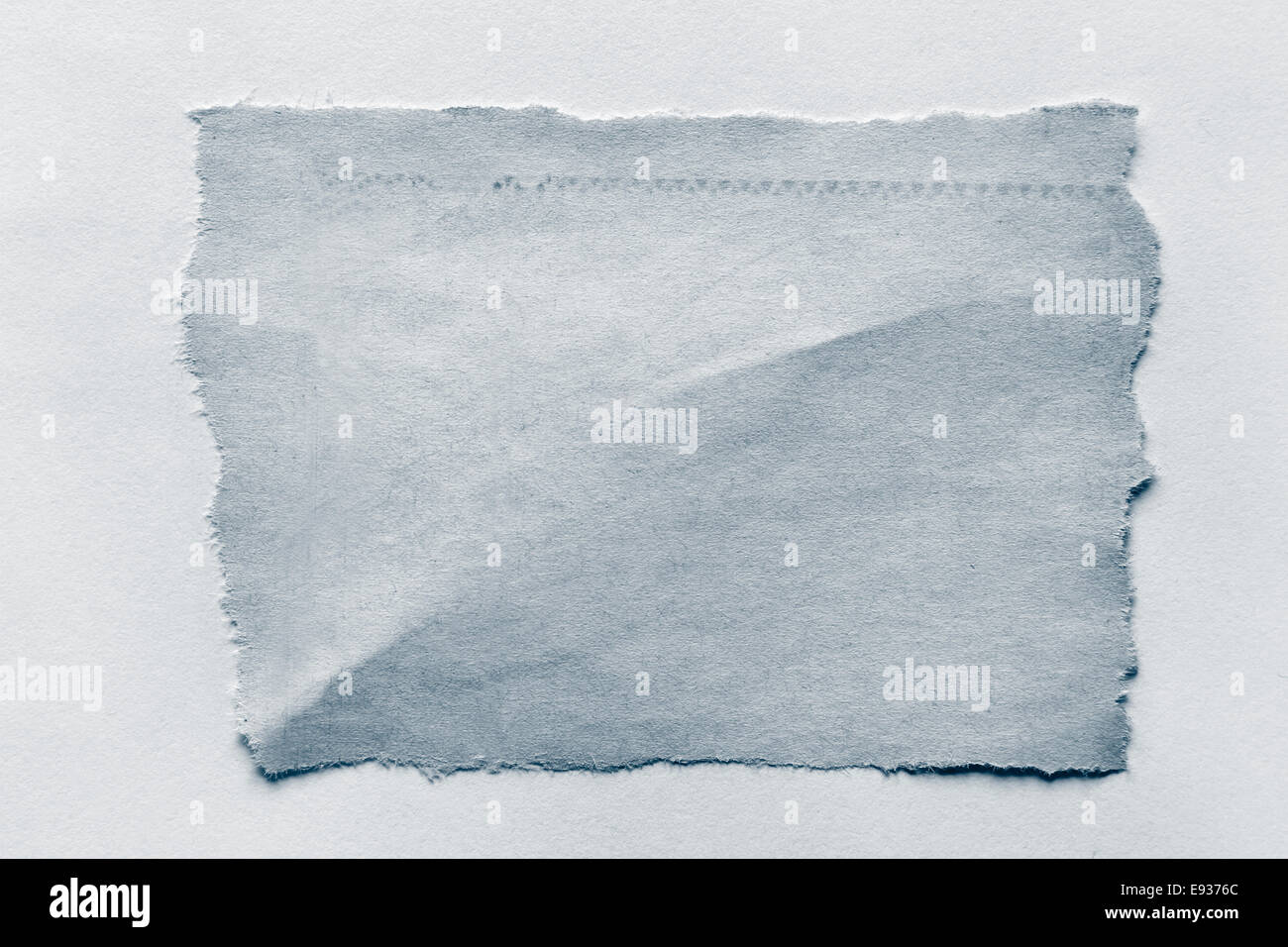 Piece of torn paper on plain background Stock Photo - Alamy
