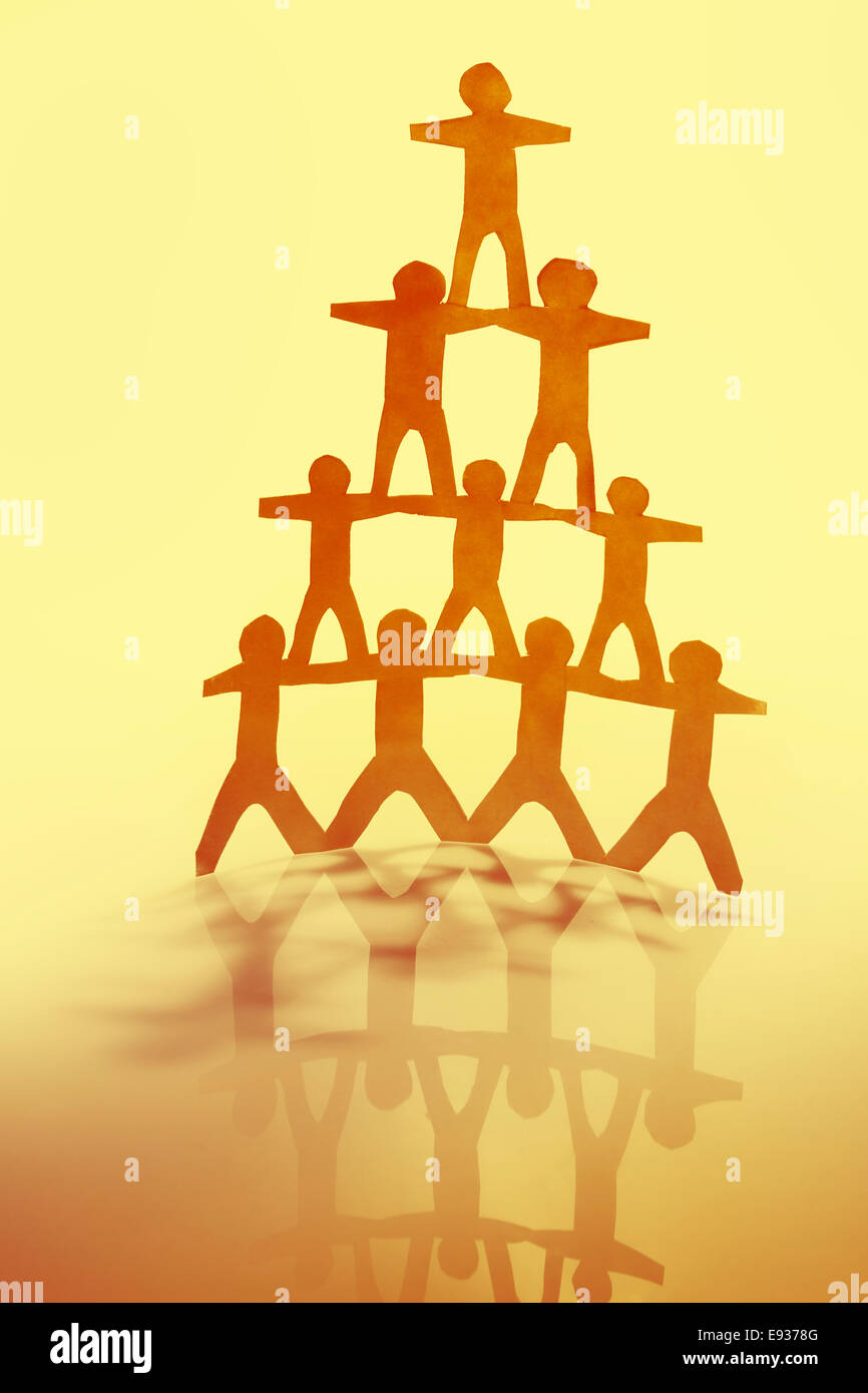 Human team pyramid holding hands Stock Photo - Alamy