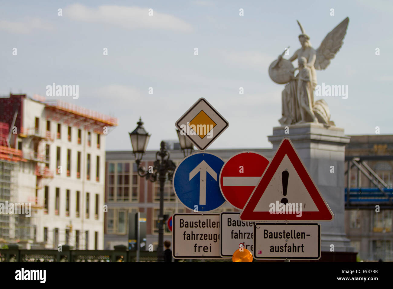warning street signs street Berlin statue one way Stock Photo - Alamy