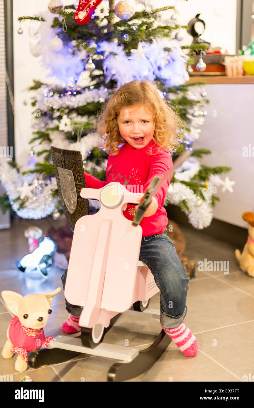 Little girl playing with her new toys Stock Photo - Alamy